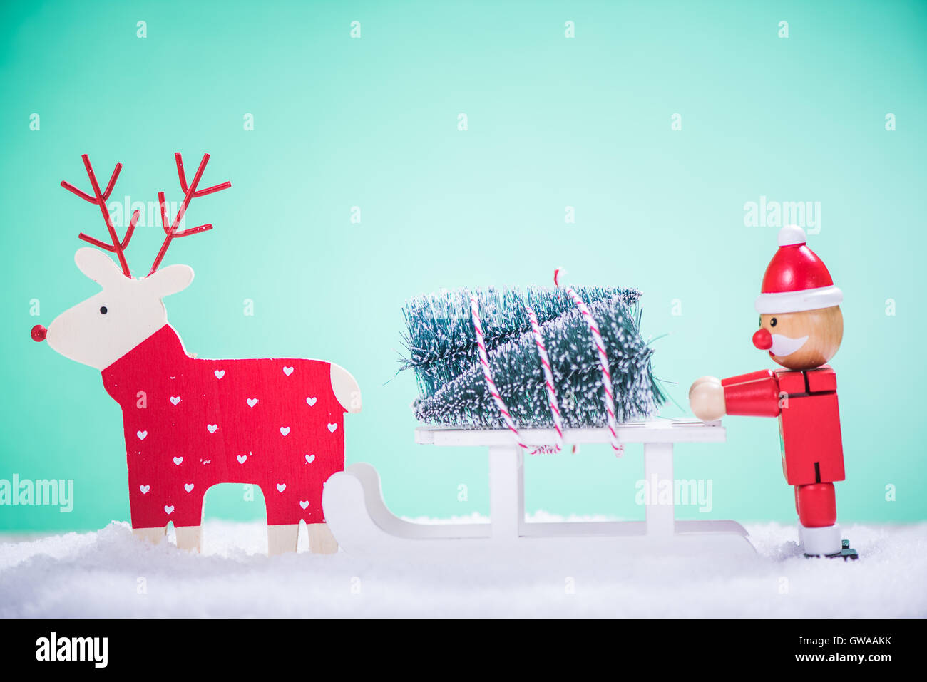 Santa helping reindeer with Christmas trees, funny Christmas scene ...