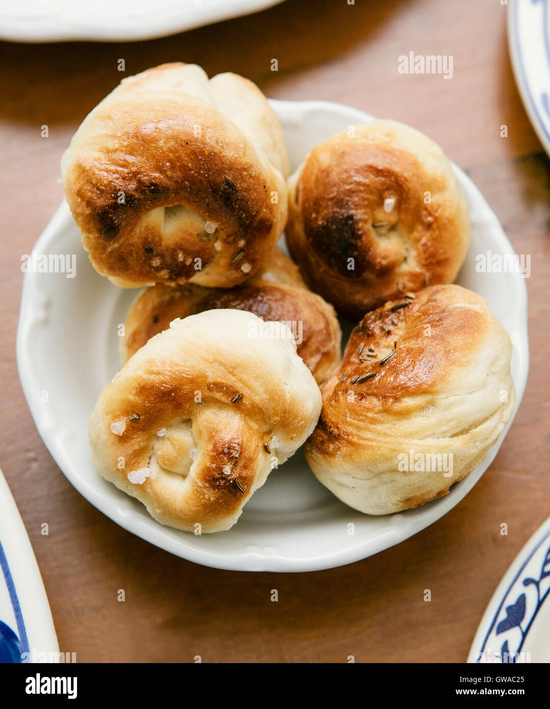 a small white dish of bread that is home made Stock Photo - Alamy
