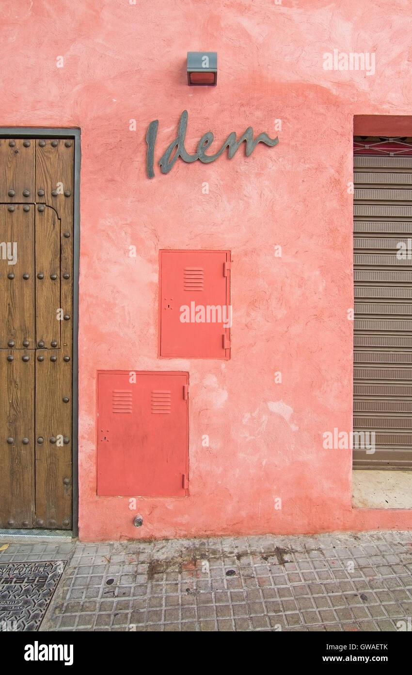 Idem sign on red roughcast wall in Santa Catalina on a summer day on ...