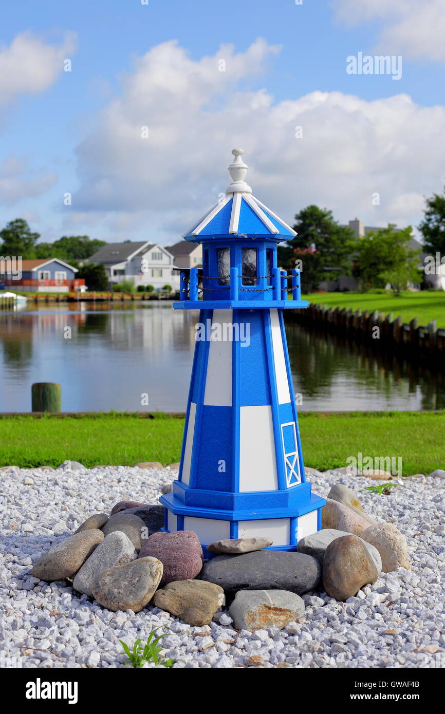 Miniature blue and white checkered lighthouse Stock Photo - Alamy