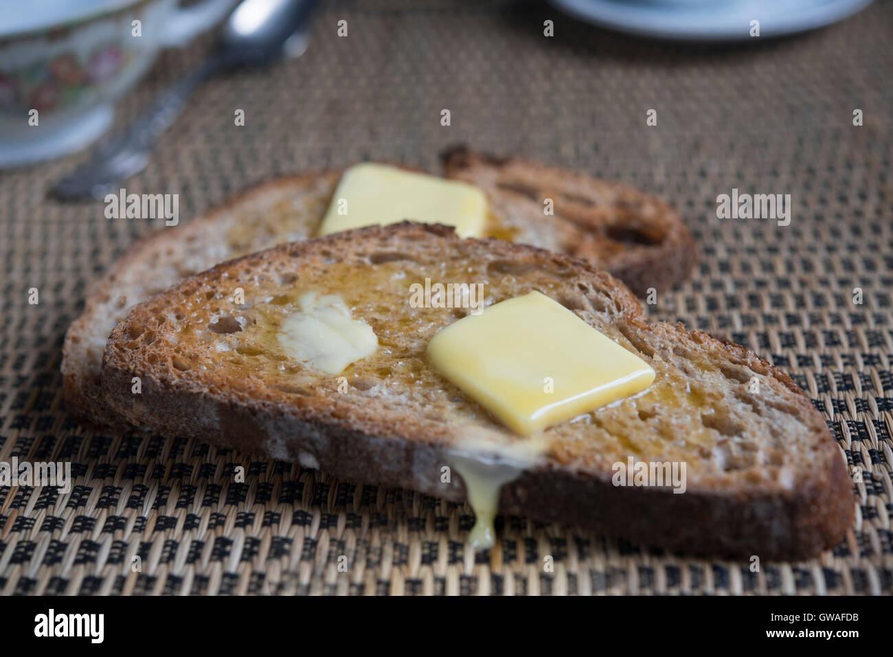 Toast with melted butter Stock Photo - Alamy