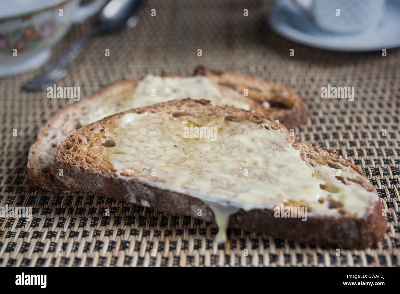 Toast with melted butter Stock Photo - Alamy