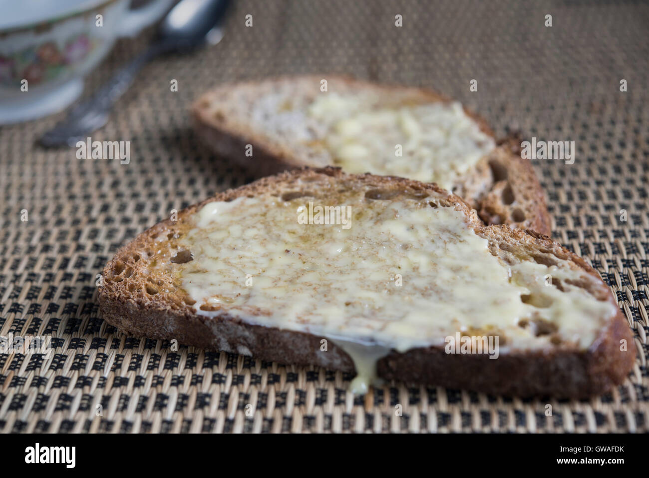 Toast with melted butter Stock Photo - Alamy