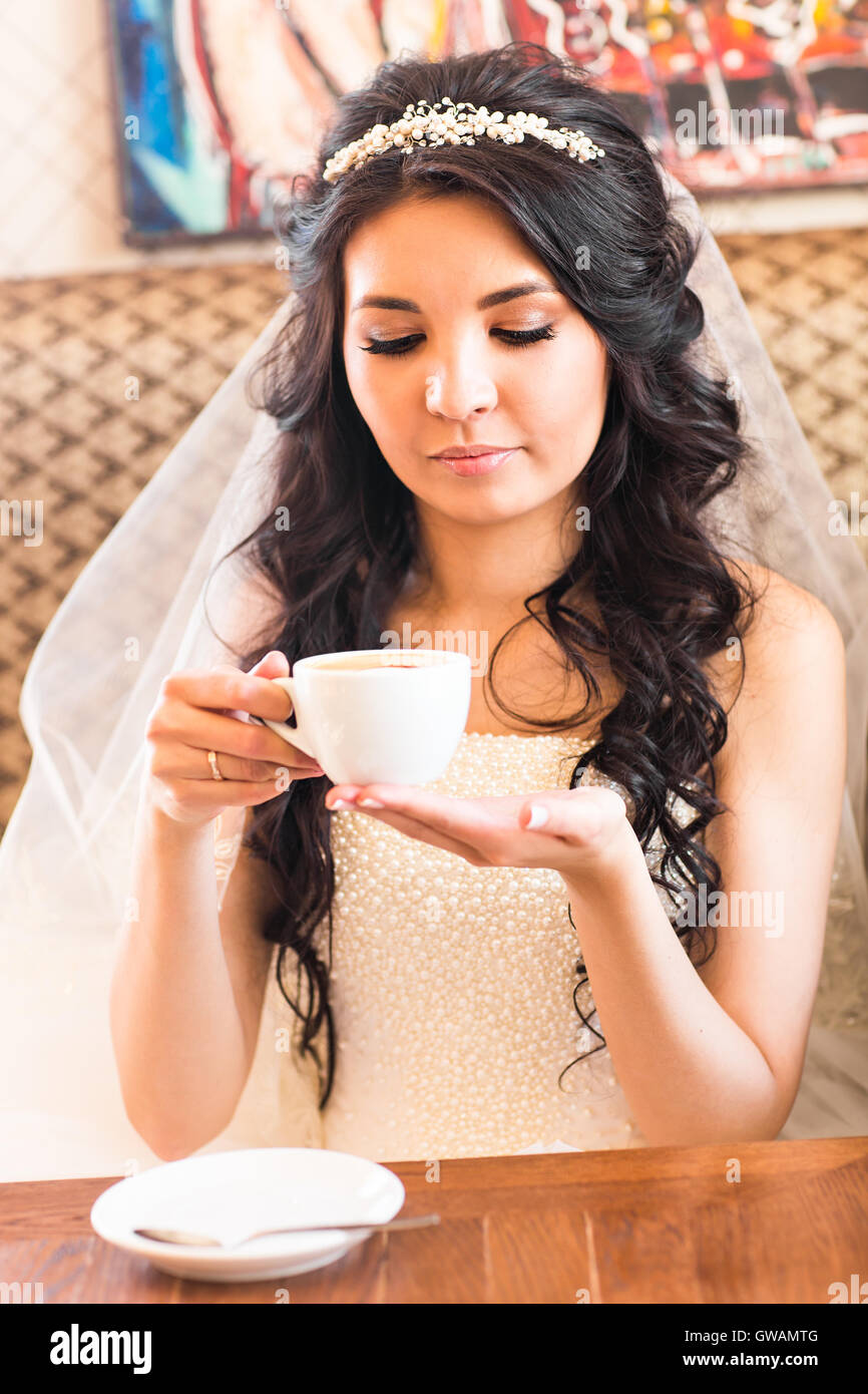 Bride drinking coffee at a wedding day Stock Photo - Alamy