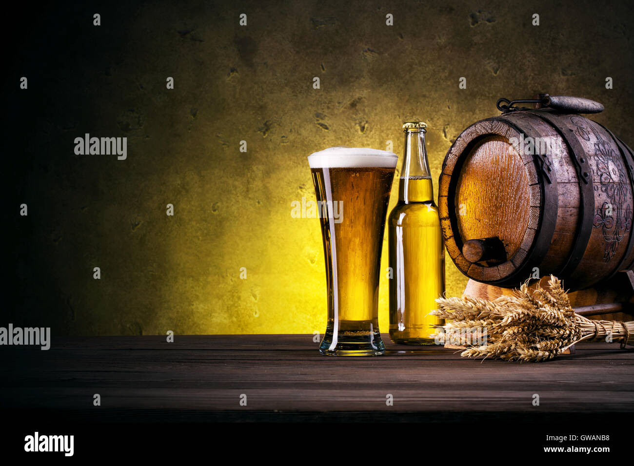 Tall glass of beer from the keg and bottle Stock Photo - Alamy