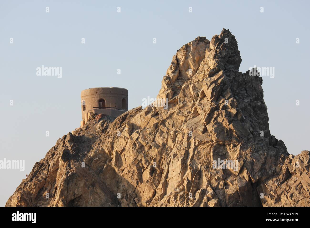 Historic tower in Muscat, Oman. An isolated towers trough rocks Stock ...