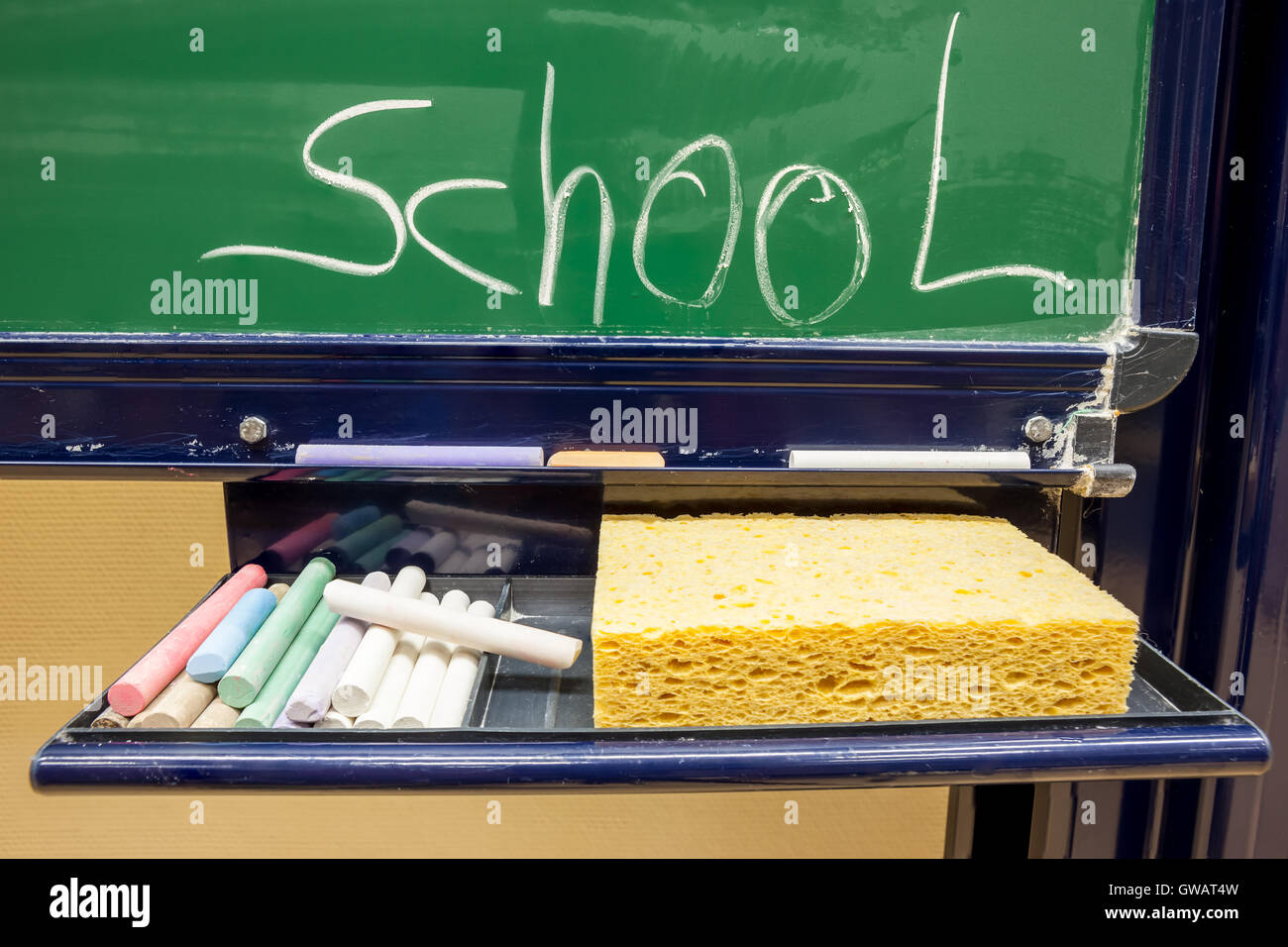 there is color chalk and sponge on the blackboard Stock Photo - Alamy