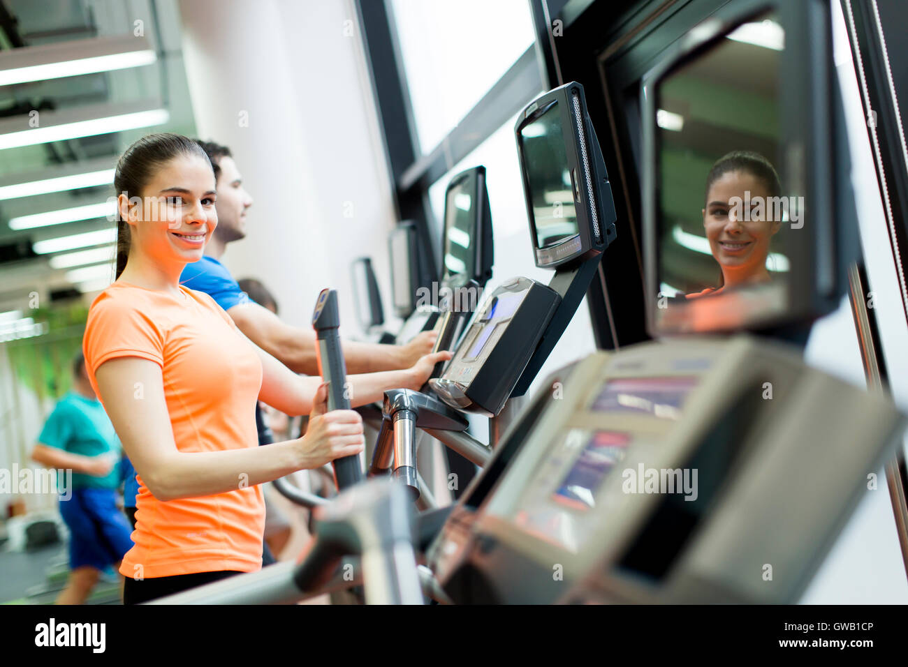 Young woman exercise on the treadmill at the gym Stock Photo - Alamy