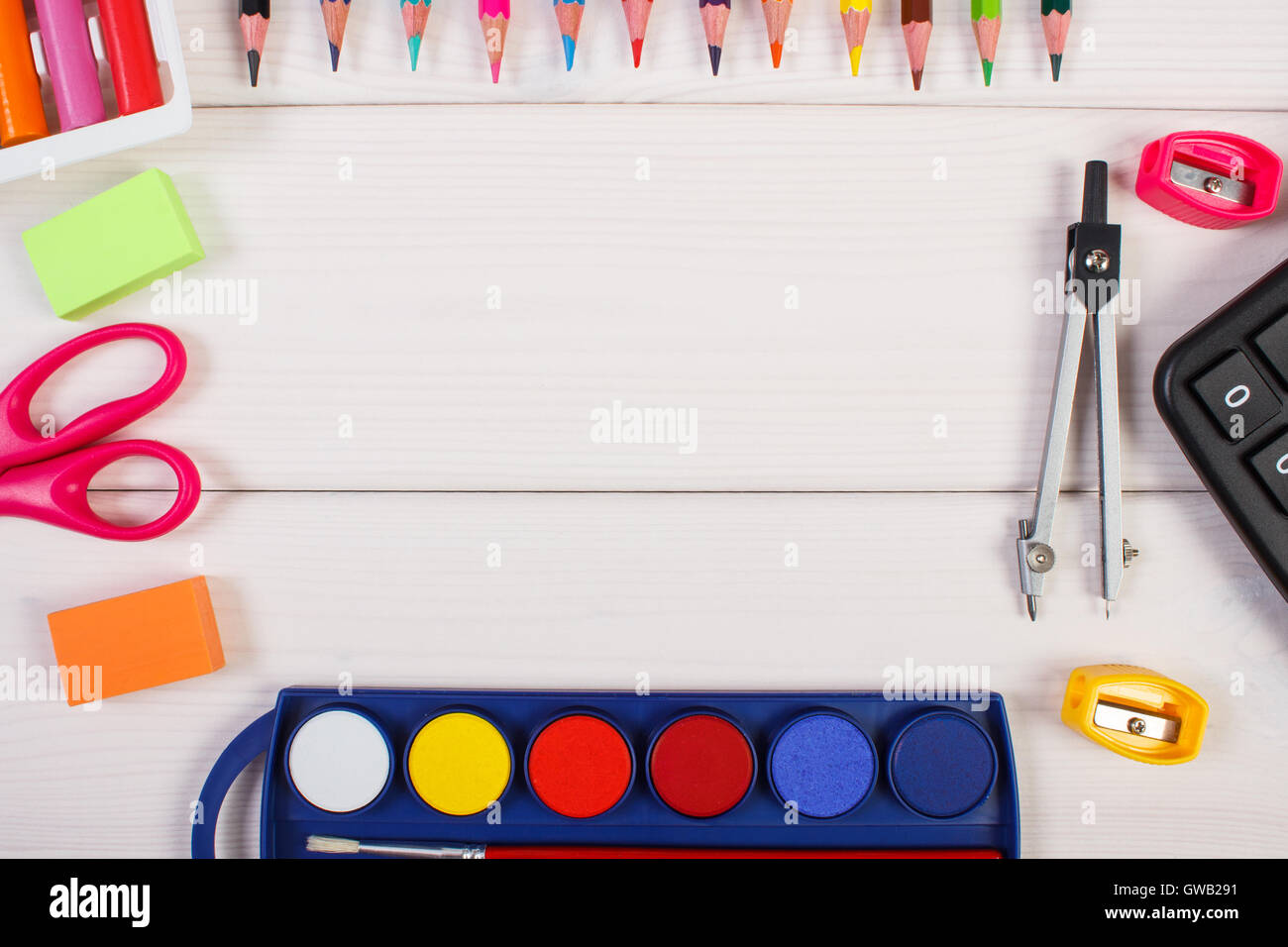 Frame of school and office accessories on white boards, copy space for ...