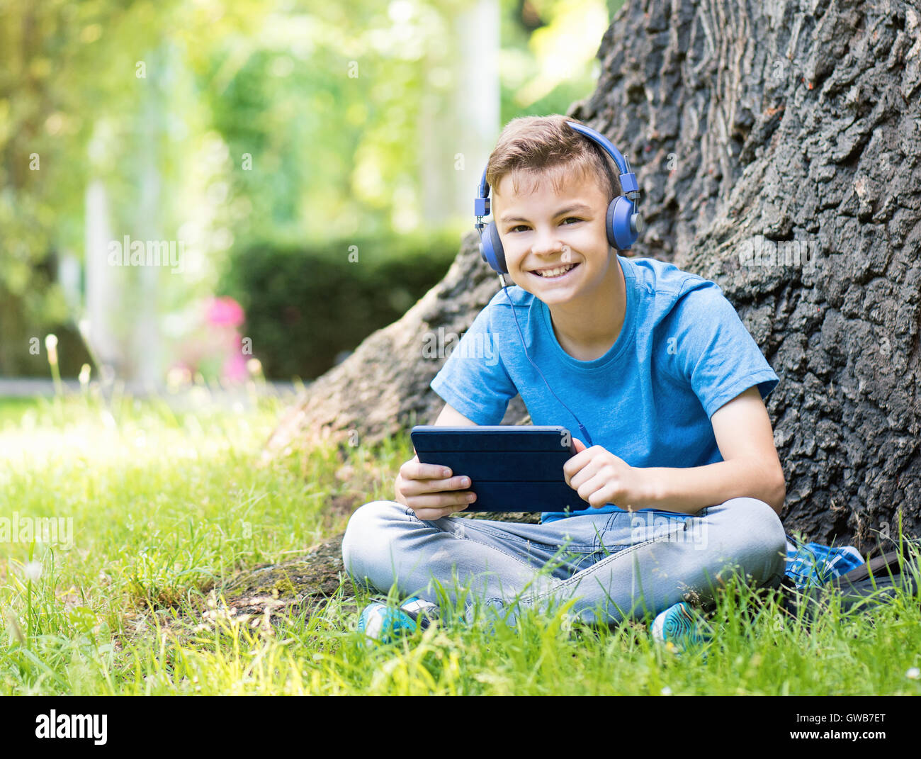 Boy with tablet Stock Photo - Alamy