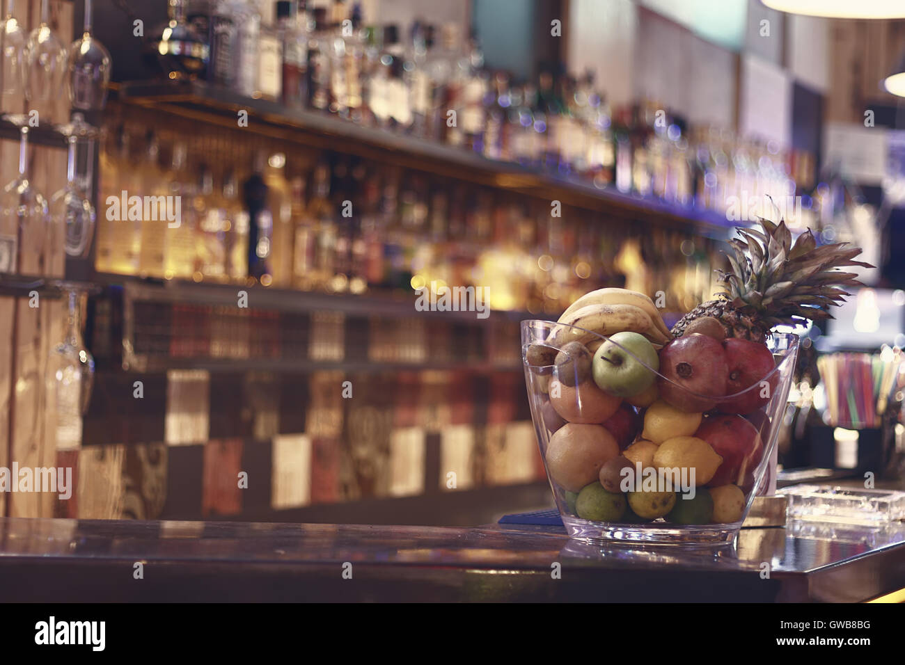 Blurred back bar. Bottles of spirits and liquor at the bar. Blurred ...