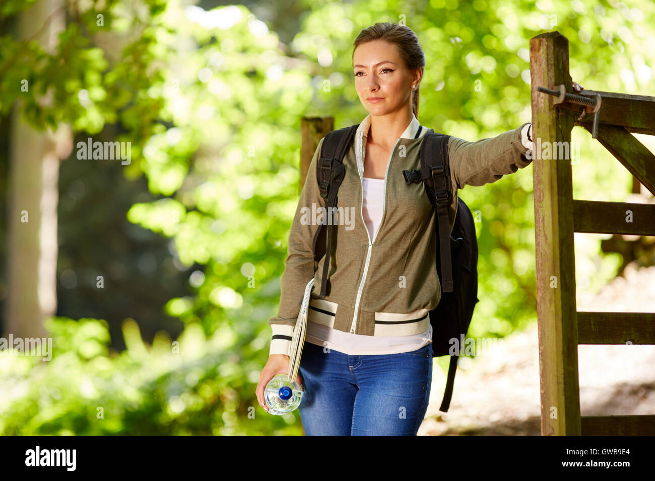 Woman walking in countryside Stock Photo - Alamy