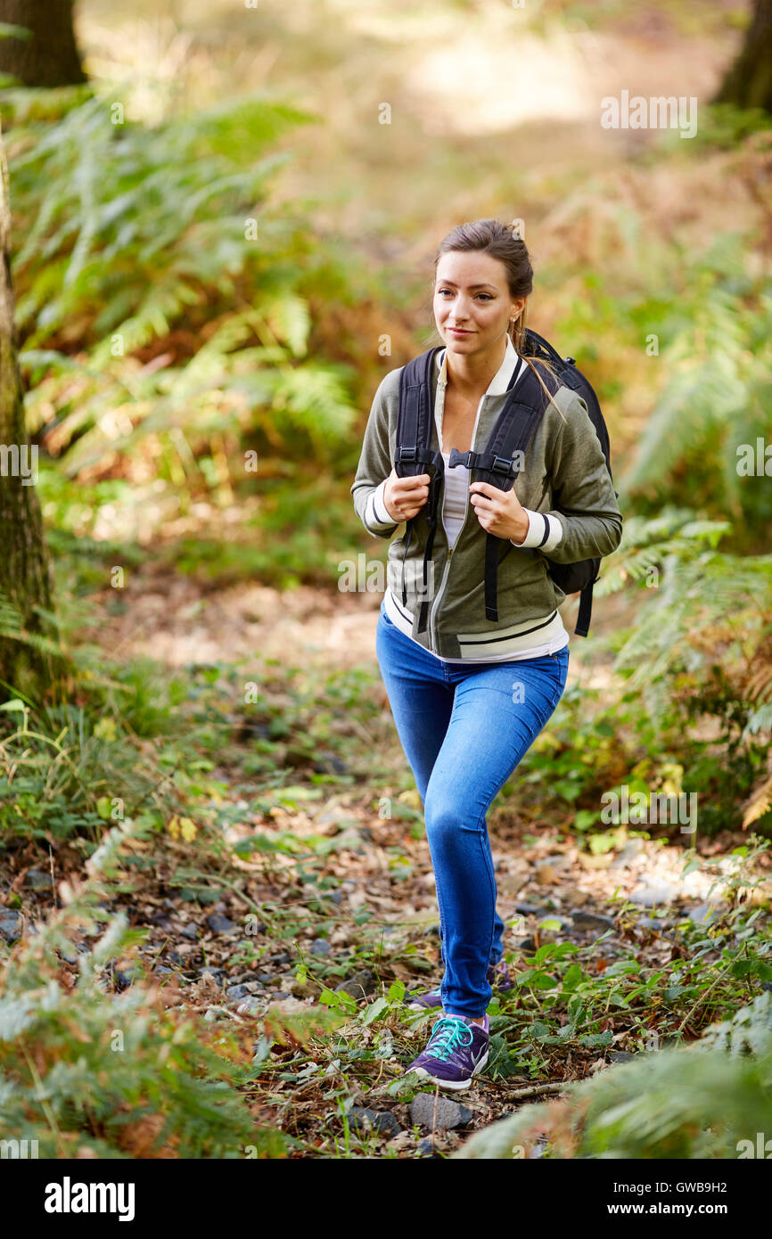 Woman walking in countryside Stock Photo - Alamy