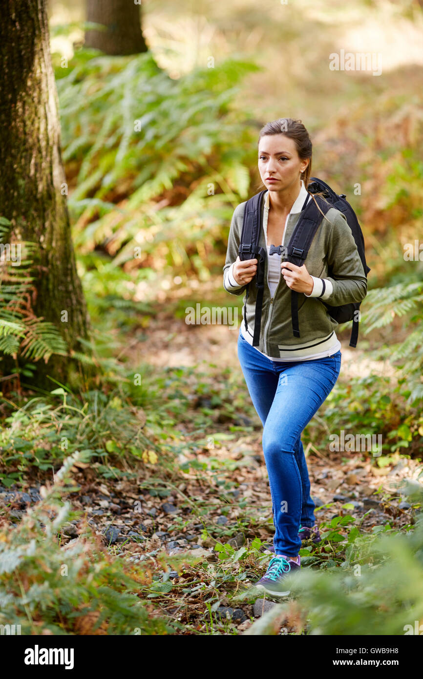Woman walking in countryside Stock Photo - Alamy