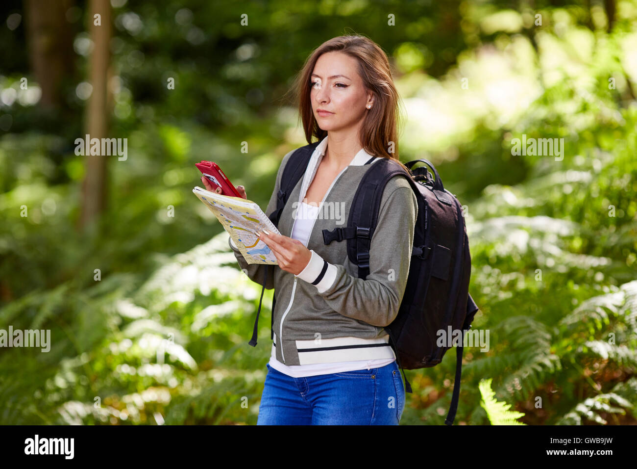 Woman walking in countryside Stock Photo - Alamy