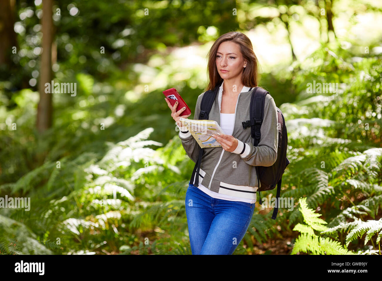 Woman walking in countryside Stock Photo - Alamy