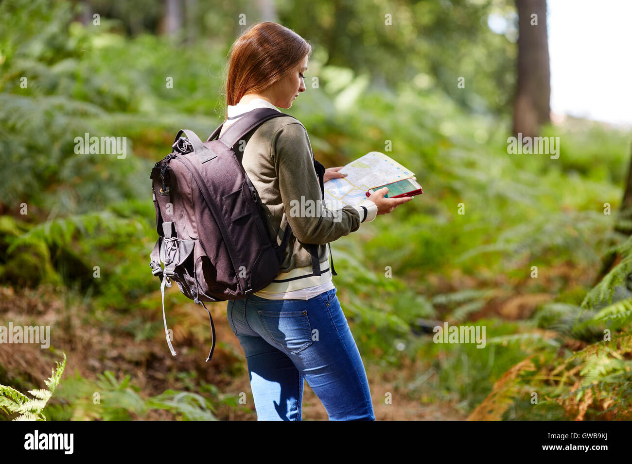 Woman walking in countryside Stock Photo - Alamy