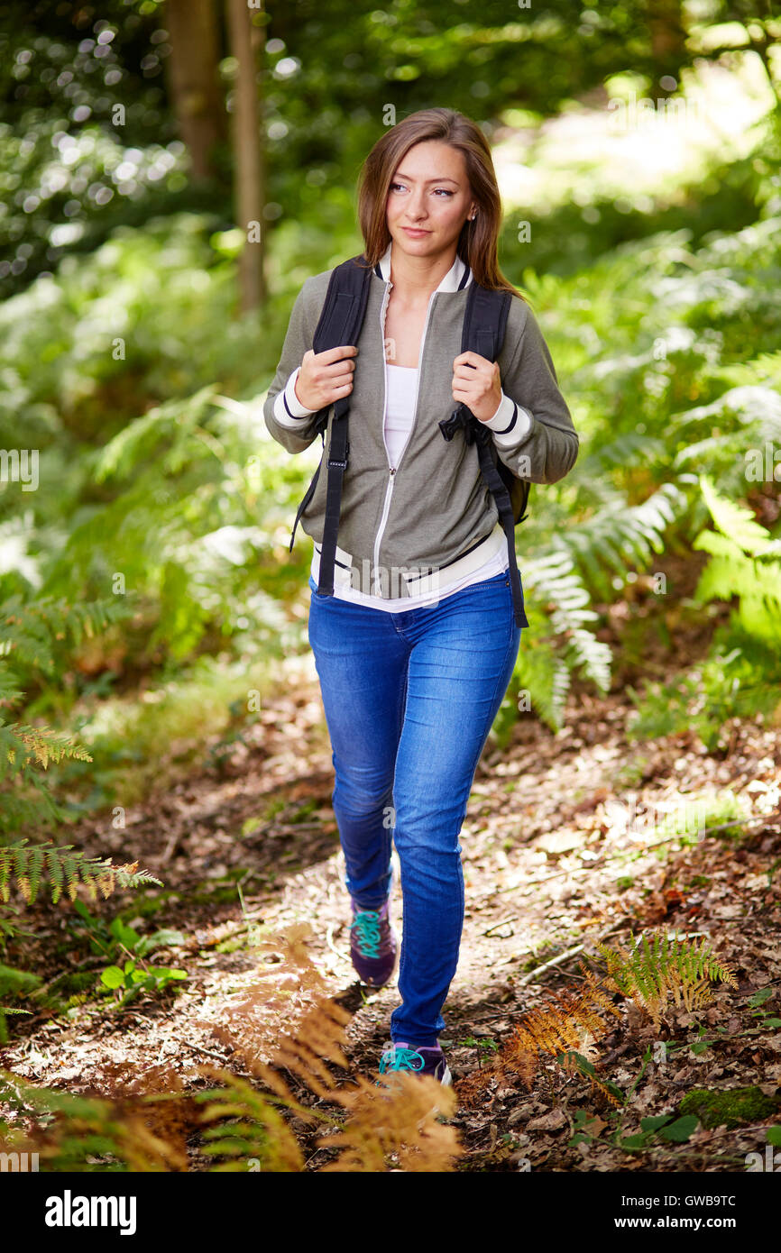 Woman walking in countryside Stock Photo - Alamy