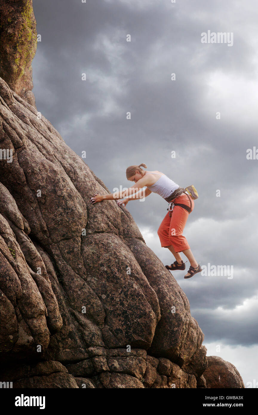 Young woman rock climbing at Elephant Rock, near Buena Vista, Colorado ...