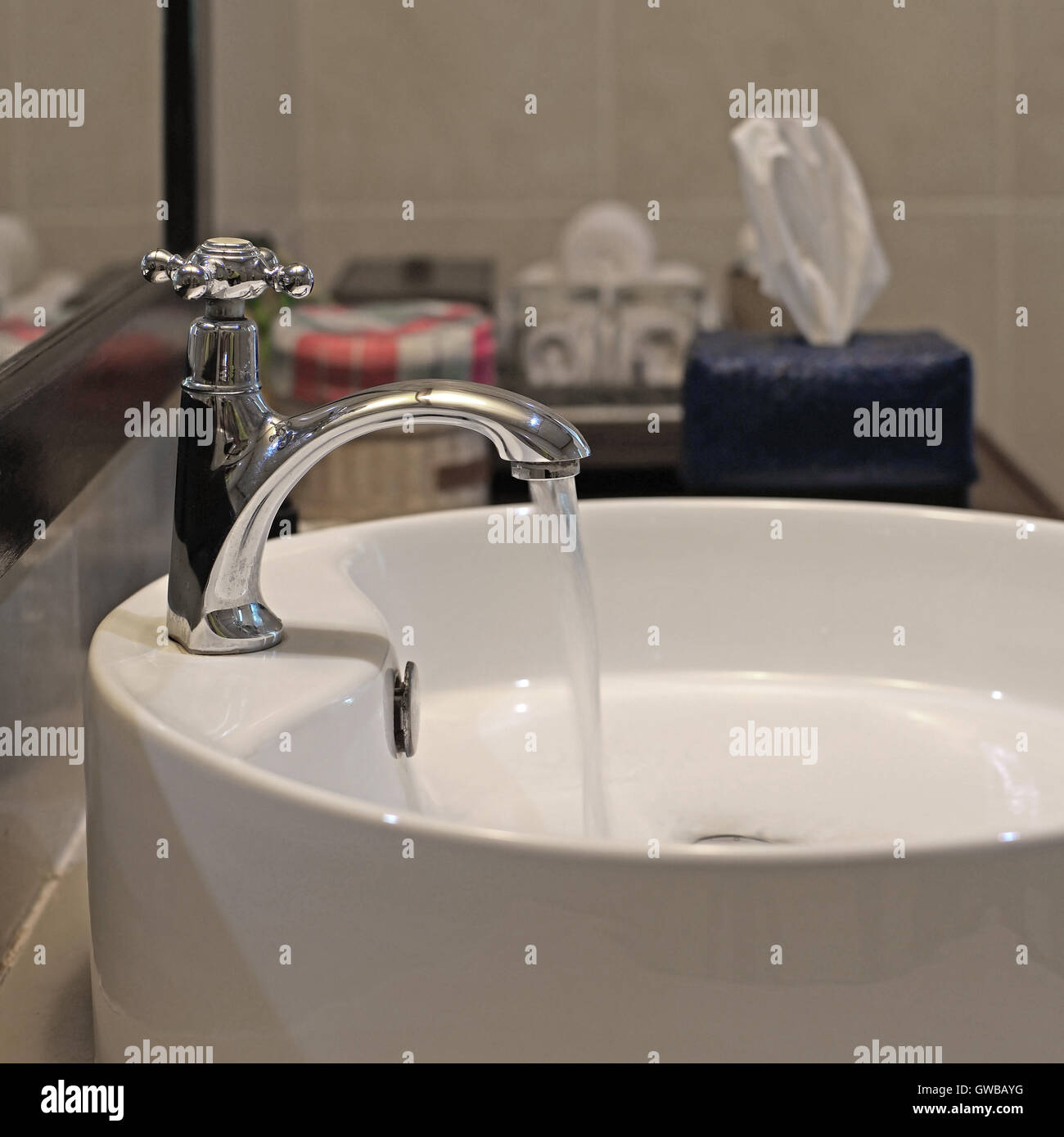 bathroom sink with running water from faucet Stock Photo - Alamy