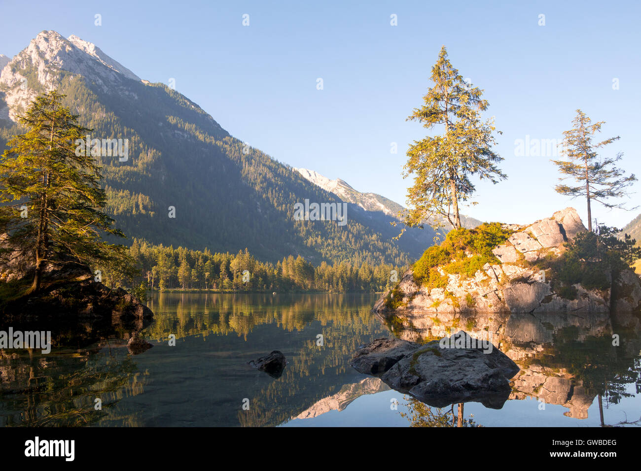 Germany. Mountain forest lake Hintersee. Water mirror, the cloudless ...