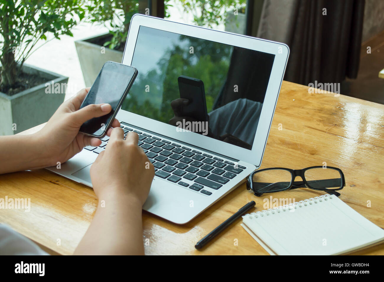 the image of woman's hands using smart phone,laptop in office Stock ...