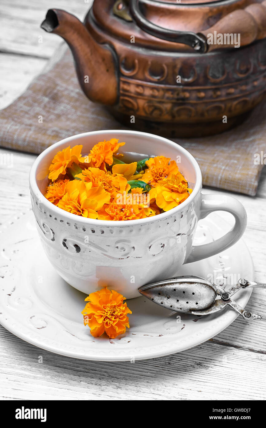 Cup of medicinal tea from the flowers of marigold Stock Photo - Alamy