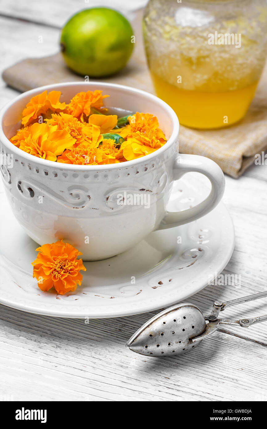 Cup of medicinal tea from the flowers of marigold Stock Photo - Alamy