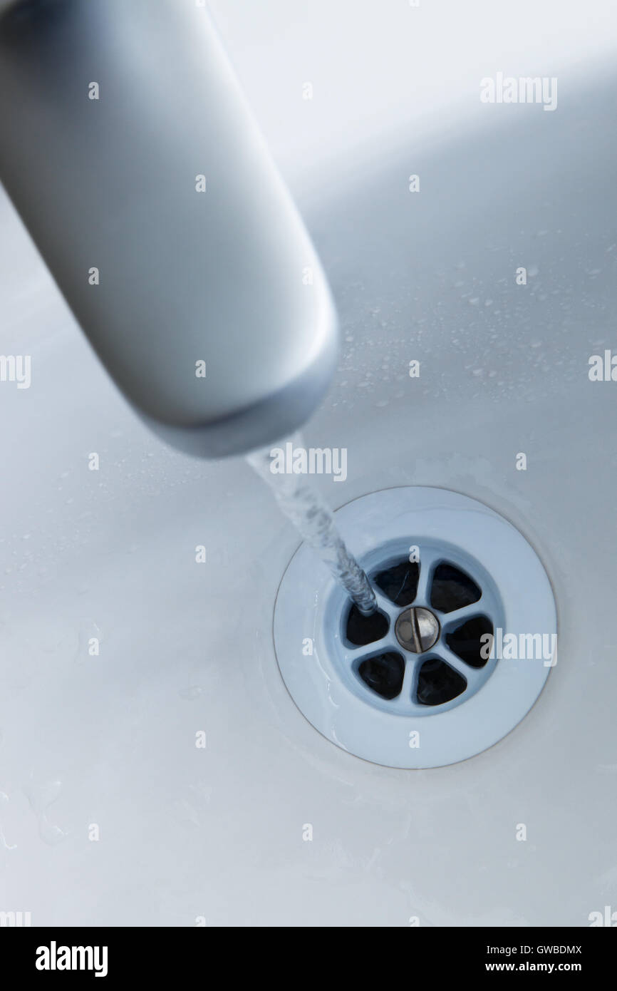 Stream and drops of pure water in a sink Stock Photo - Alamy