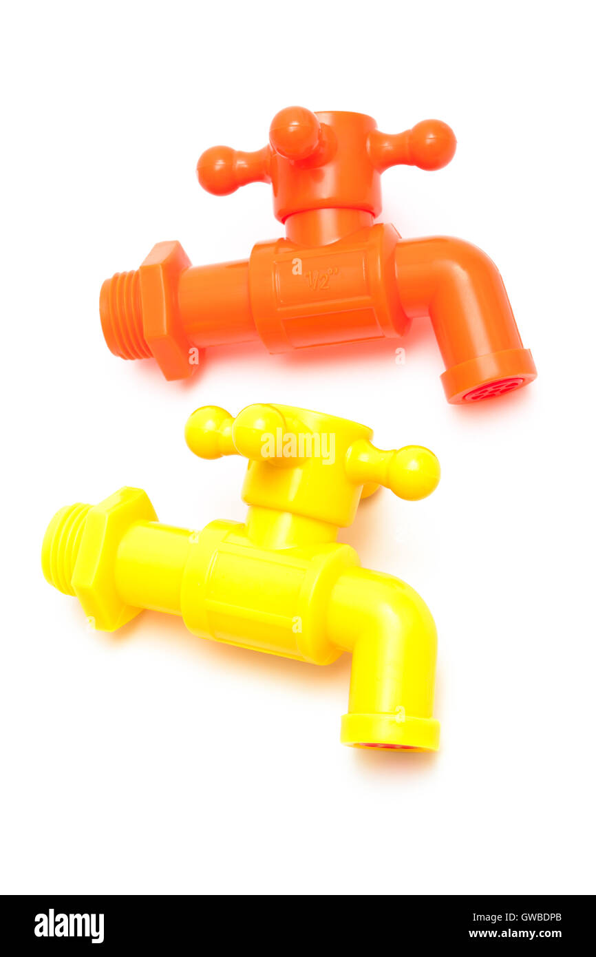 color plastic faucet on a white background Stock Photo - Alamy