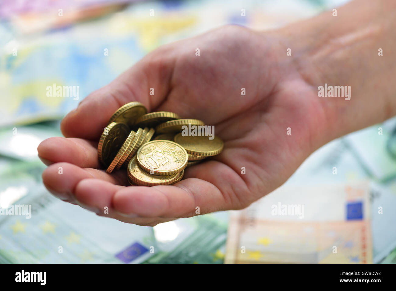 coins in man hand closeup Stock Photo - Alamy