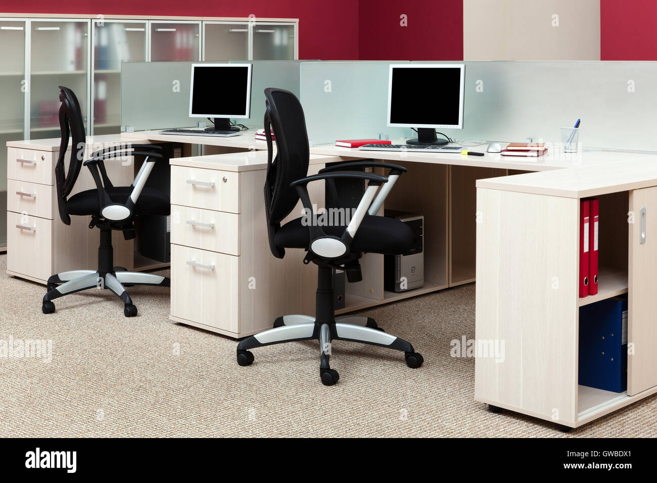 computers on the desks in a modern office Stock Photo - Alamy