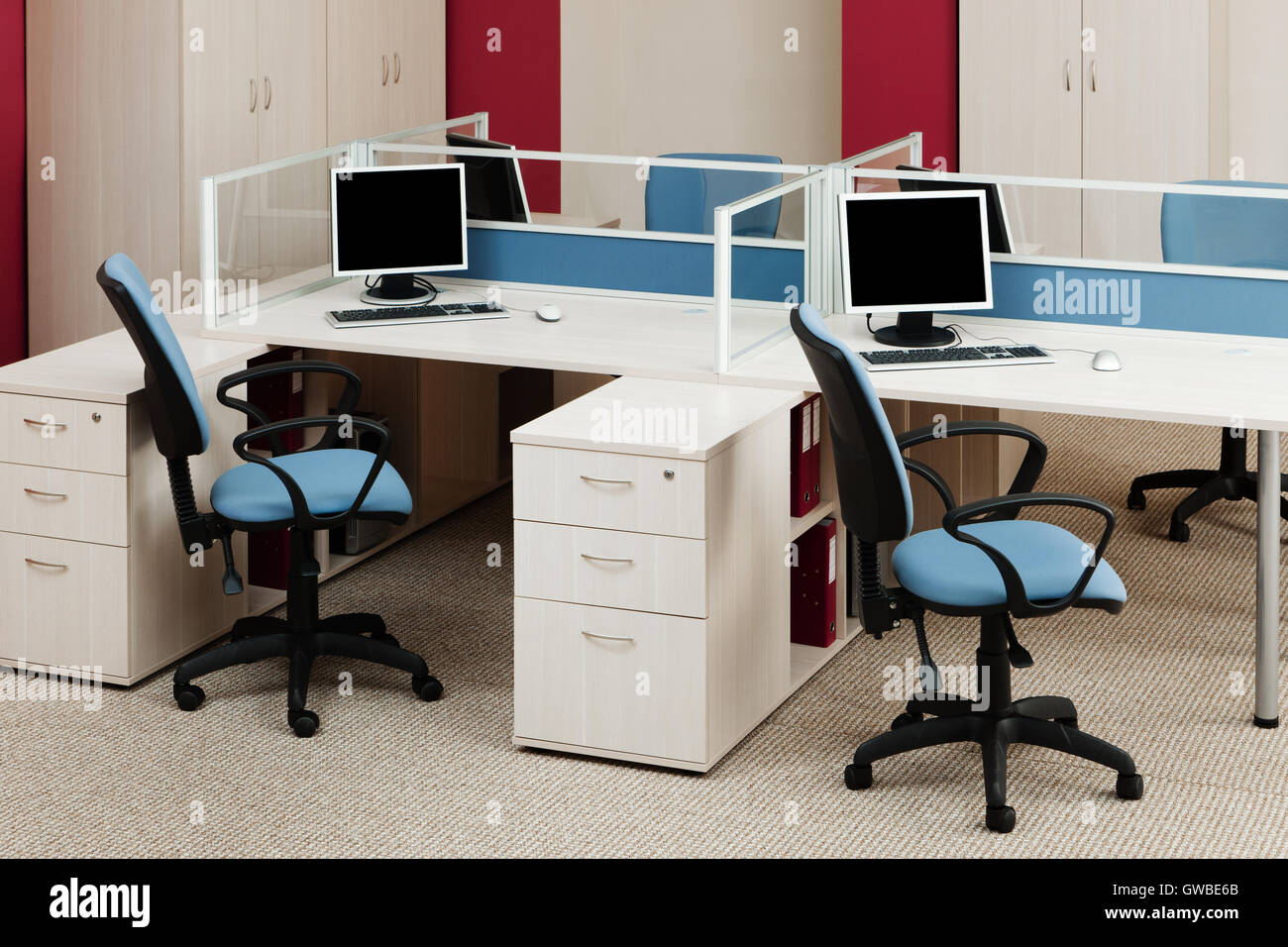 computers on the desks in a modern office Stock Photo - Alamy