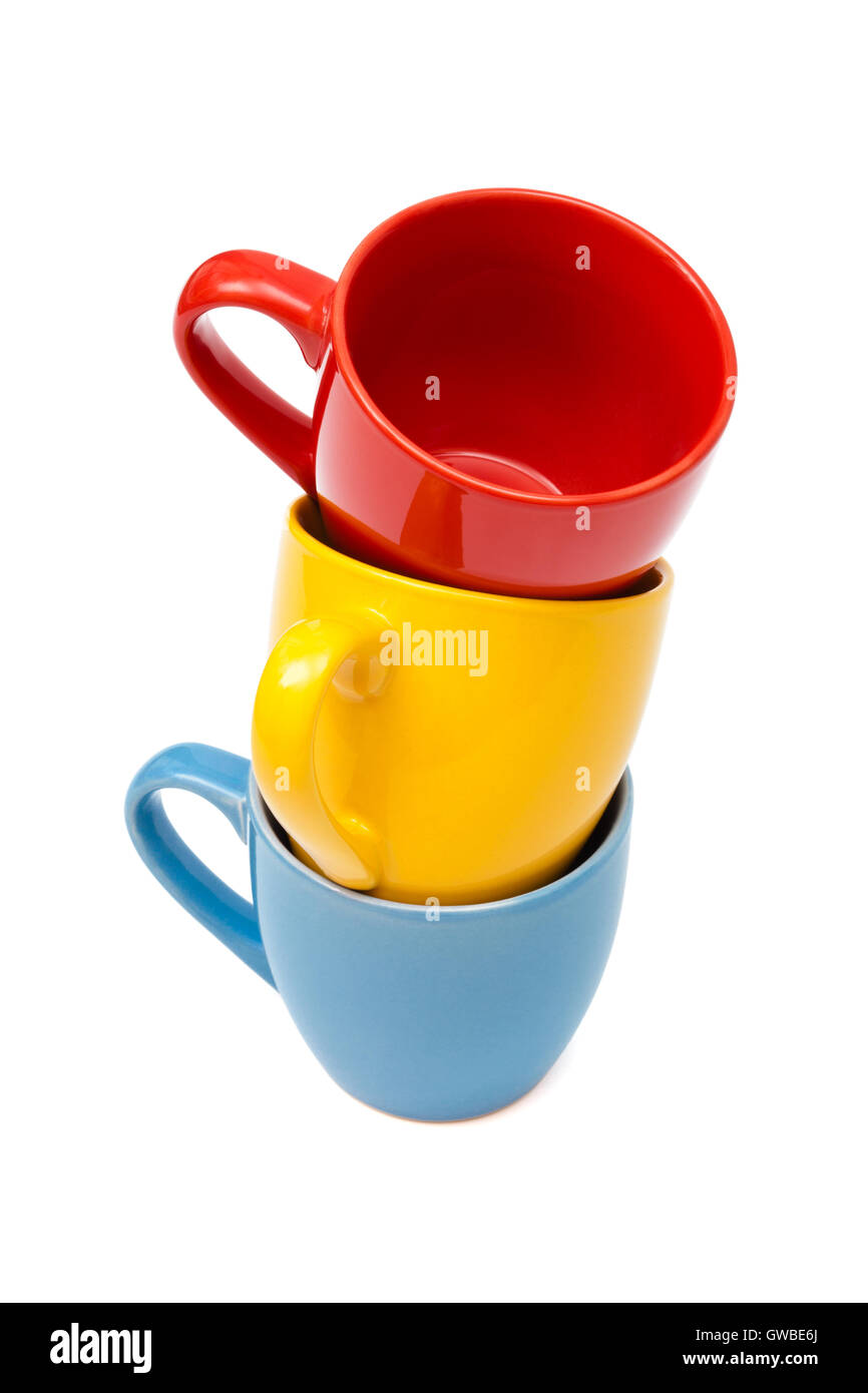 Beautiful color cups on a white background Stock Photo - Alamy