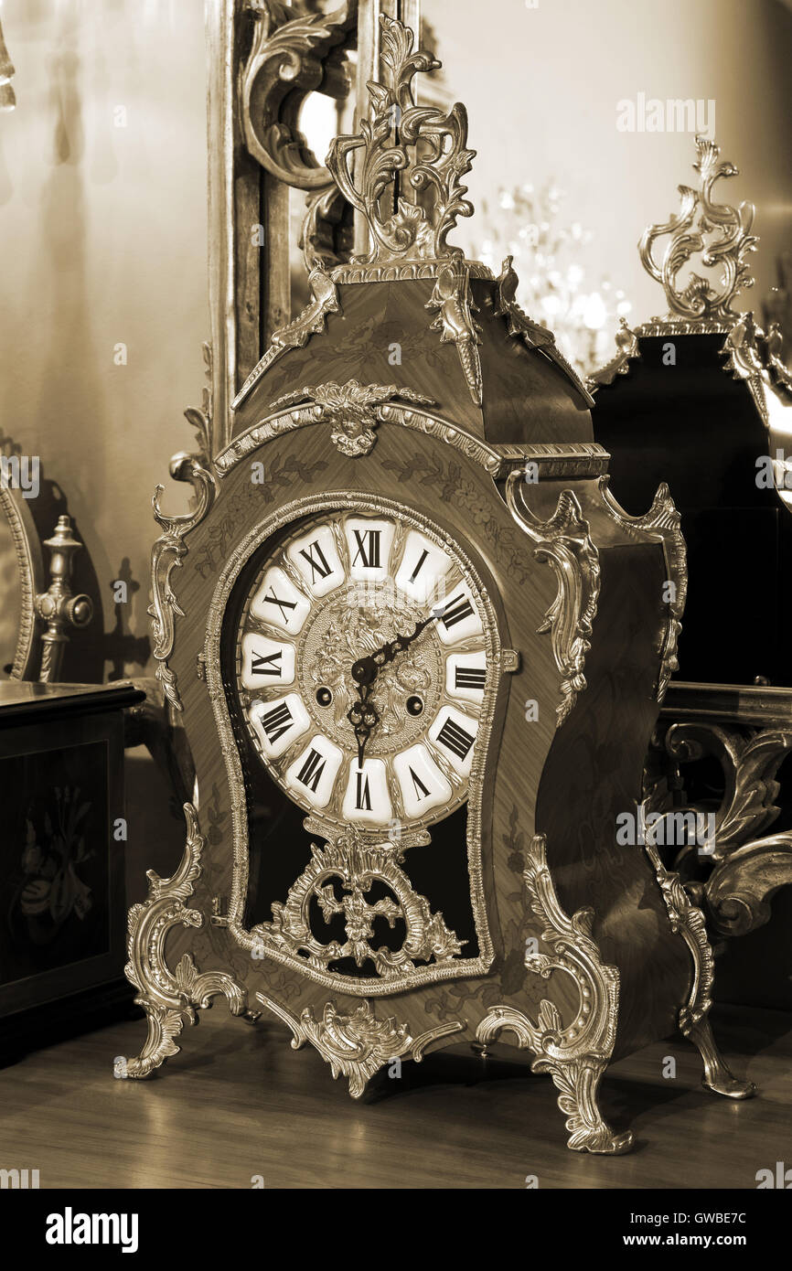 beautiful antique clock on the background of the mirror Stock Photo - Alamy