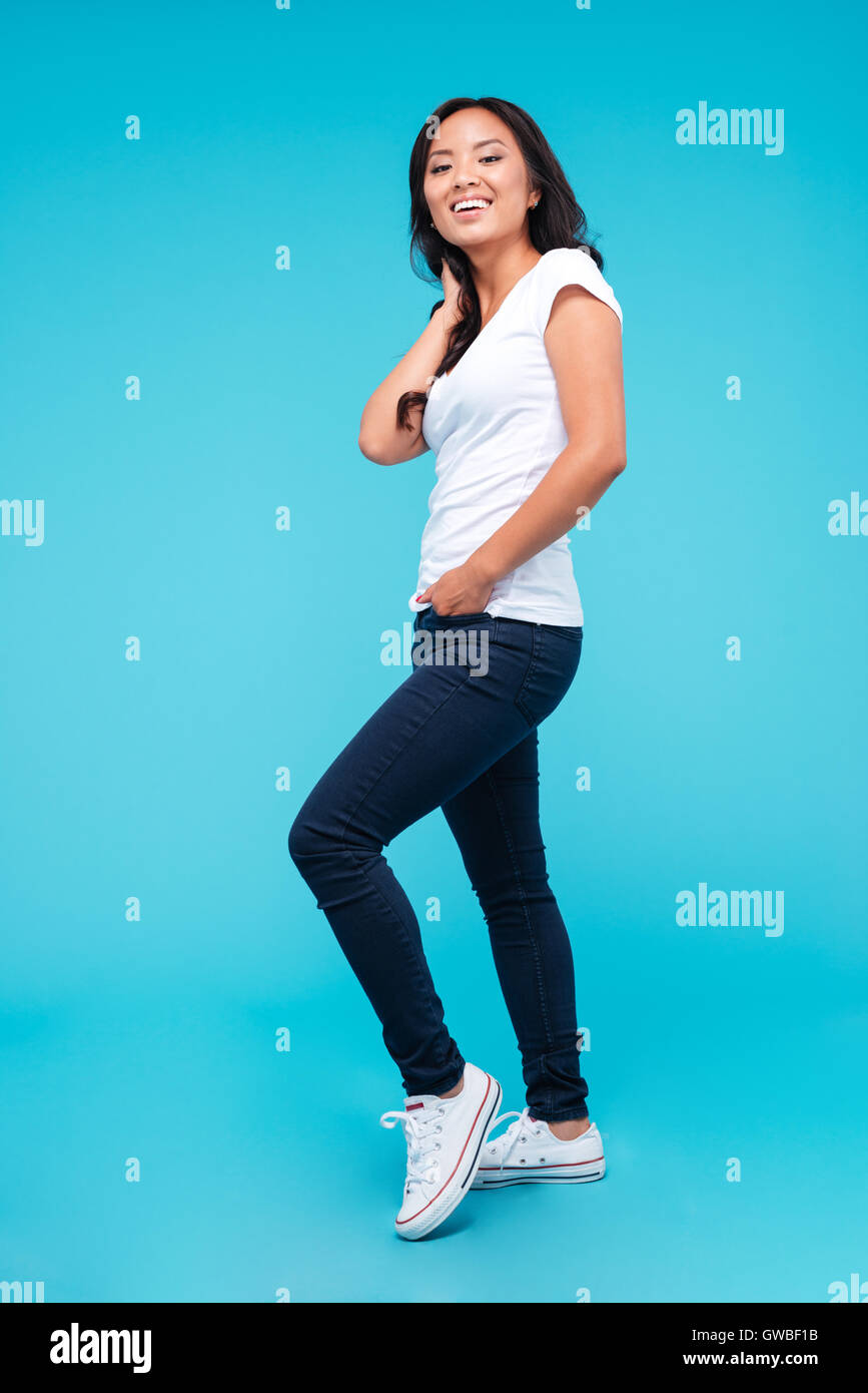 Full length portrait of a beautiful vietnamese woman posing with hand ...