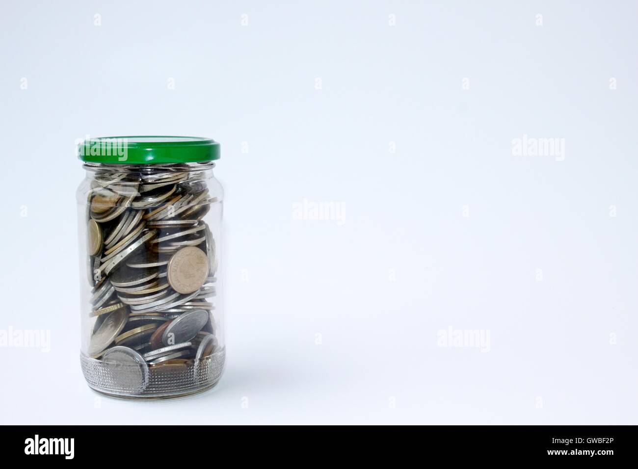 Coins money jar hi-res stock photography and images - Alamy