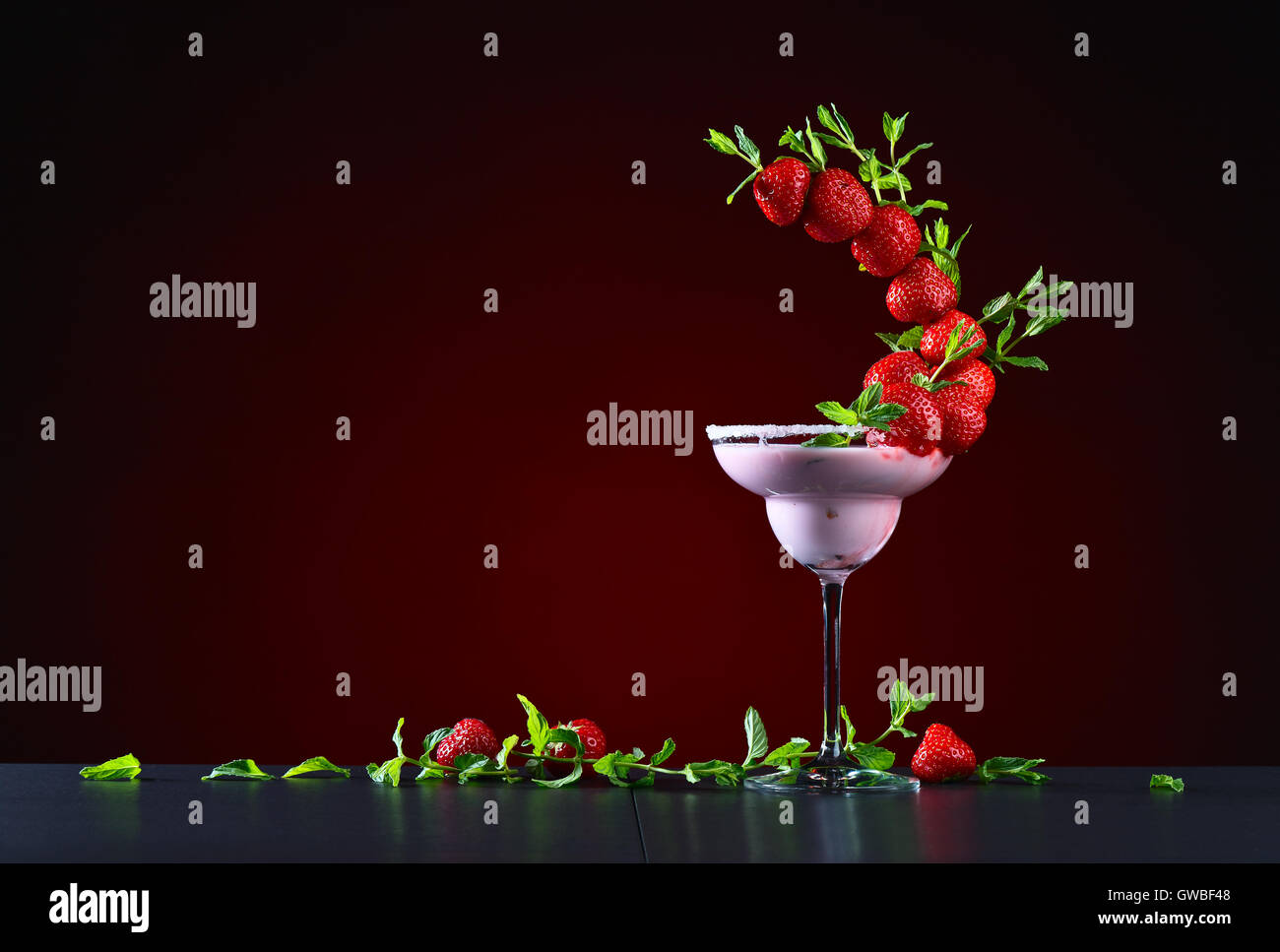 strawberry cocktail with berries and peppermint leaves Stock Photo - Alamy