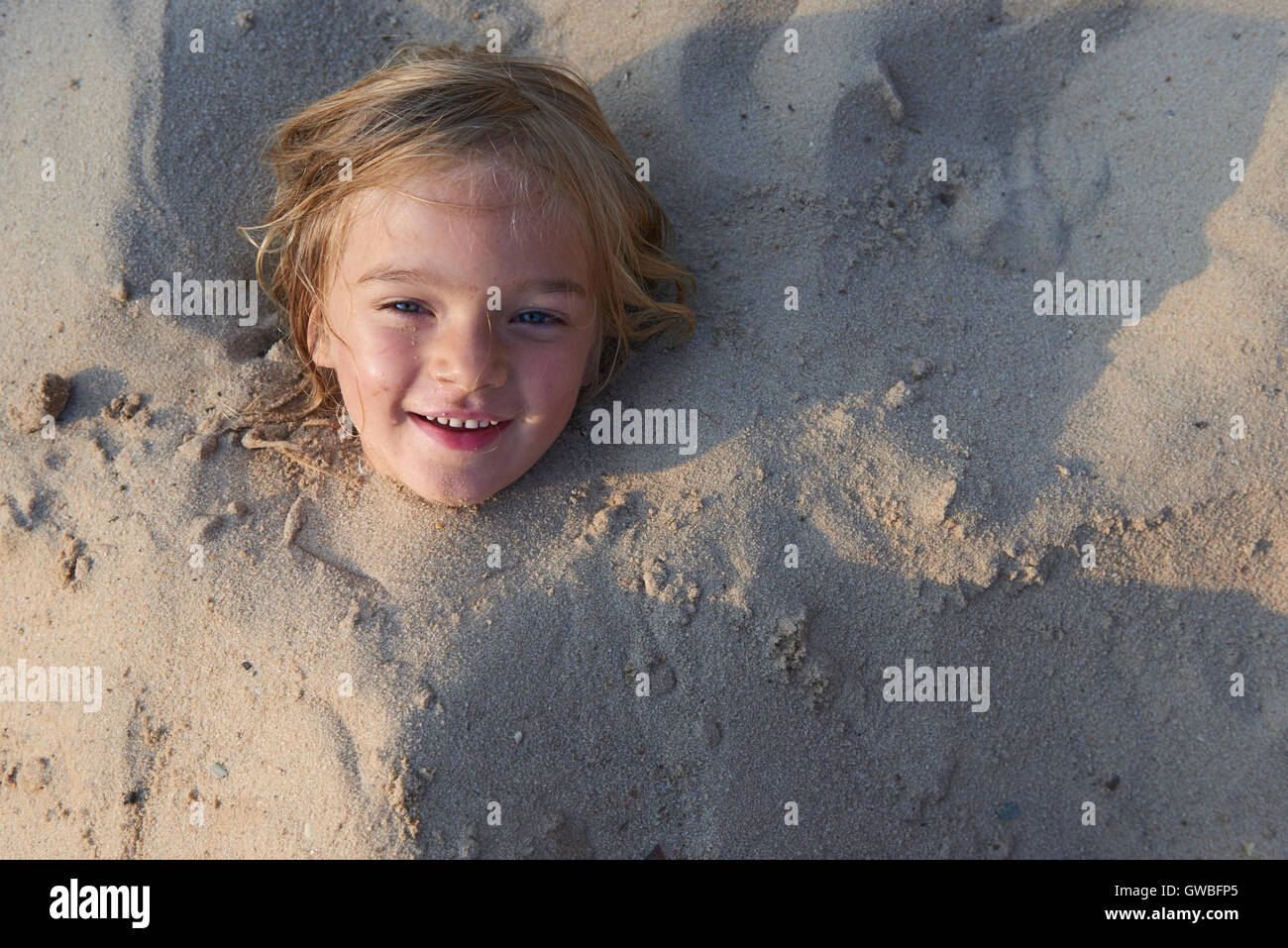Bury in sand game High Resolution Stock Photography and Images - Alamy