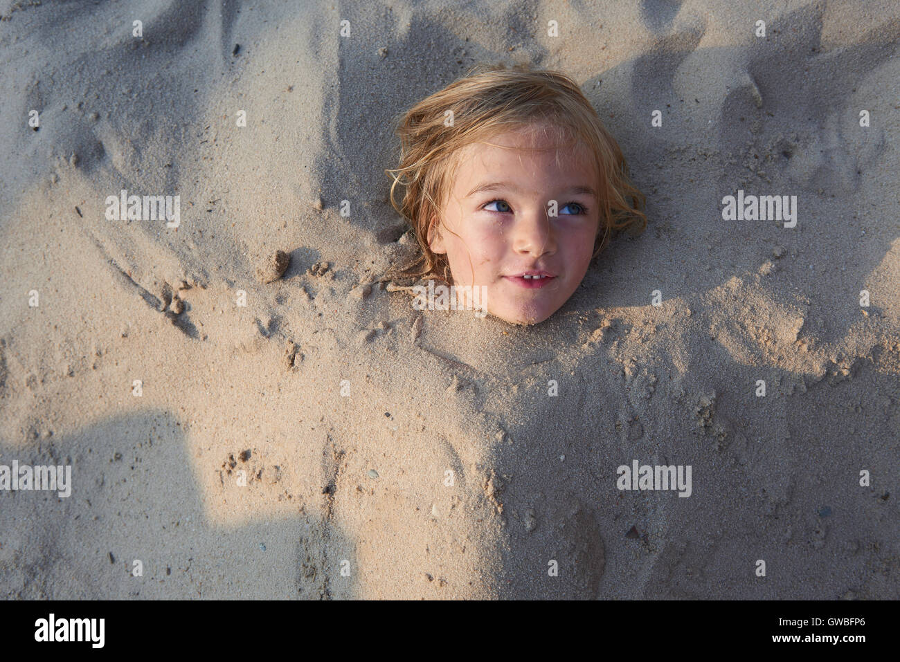 Bury in sand game hi-res stock photography and images - Alamy