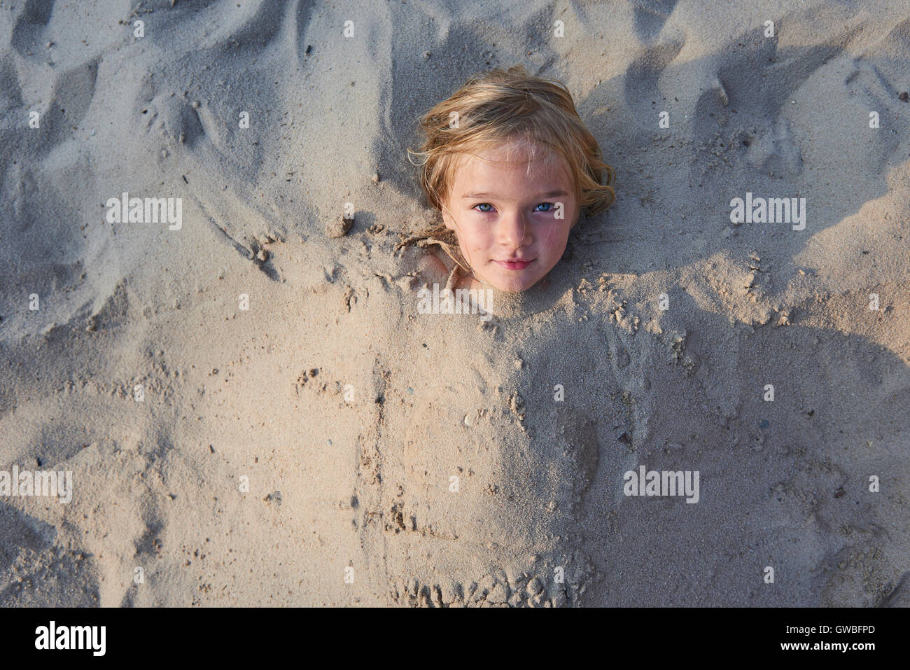 Bury in sand game hi-res stock photography and images - Alamy