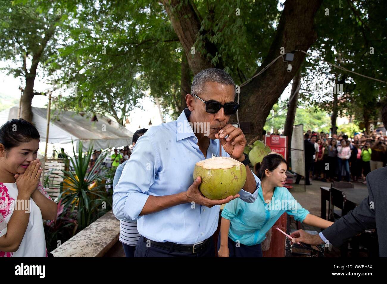 U.S President Barack Obama sips from a coconut during his visit with ...