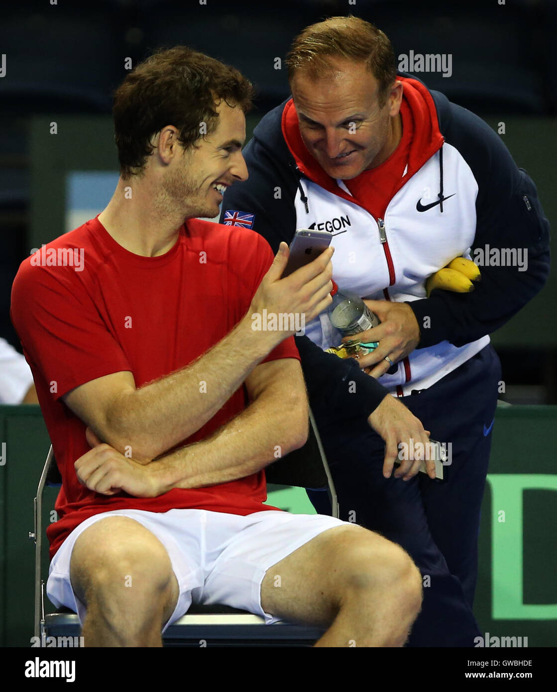 Great Britain's Andy Murray shows coach Matt Little his mobile phone ...