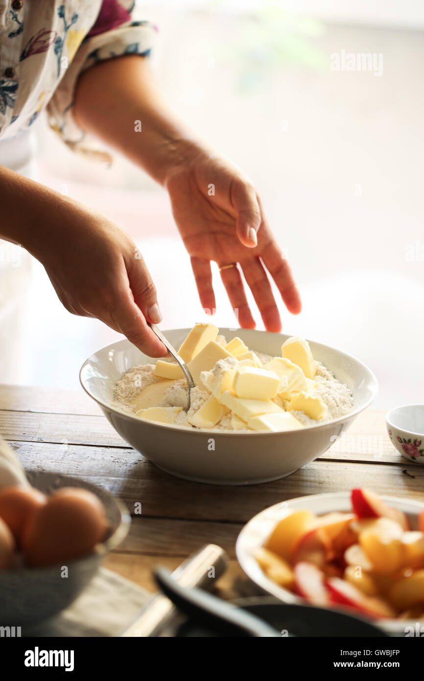 Woman mixing butter and flour Stock Photo - Alamy