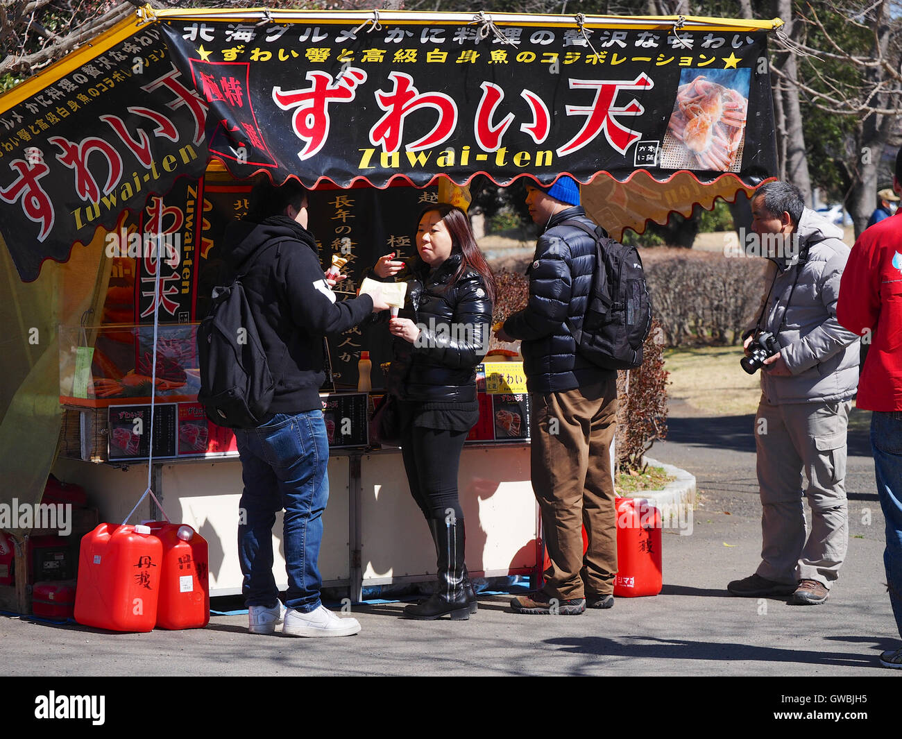 An outdoor food stall (Yatai) at Kairakuen, Ibaraki, Japan with park ...