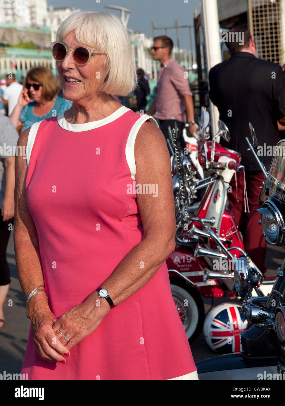 A middle-aged mod woman at a gathering on Brighton seafront Stock Photo ...