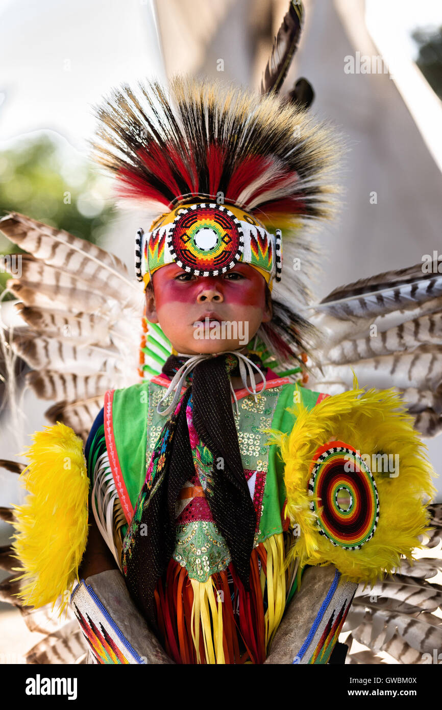 A young Native American dancer from the Arapahoe people dressed in ...