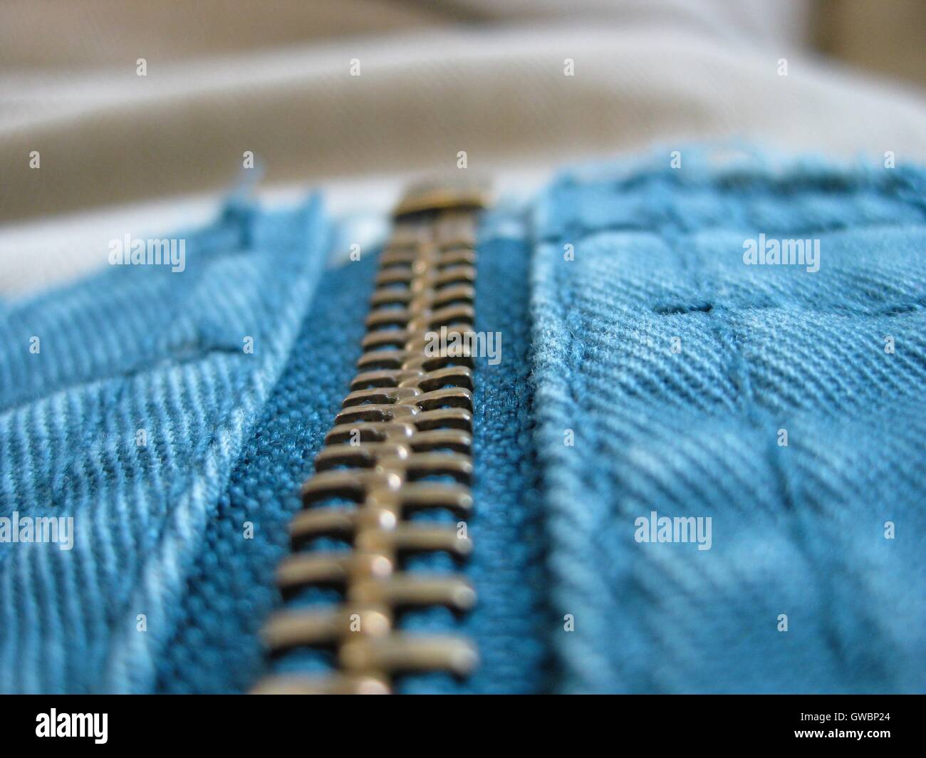 Closeup of zipper on teal denim jacket Stock Photo - Alamy