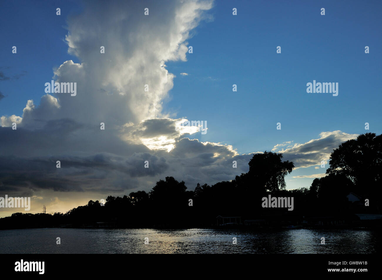 River silhouetted against unusual backlit cloud Stock Photo - Alamy