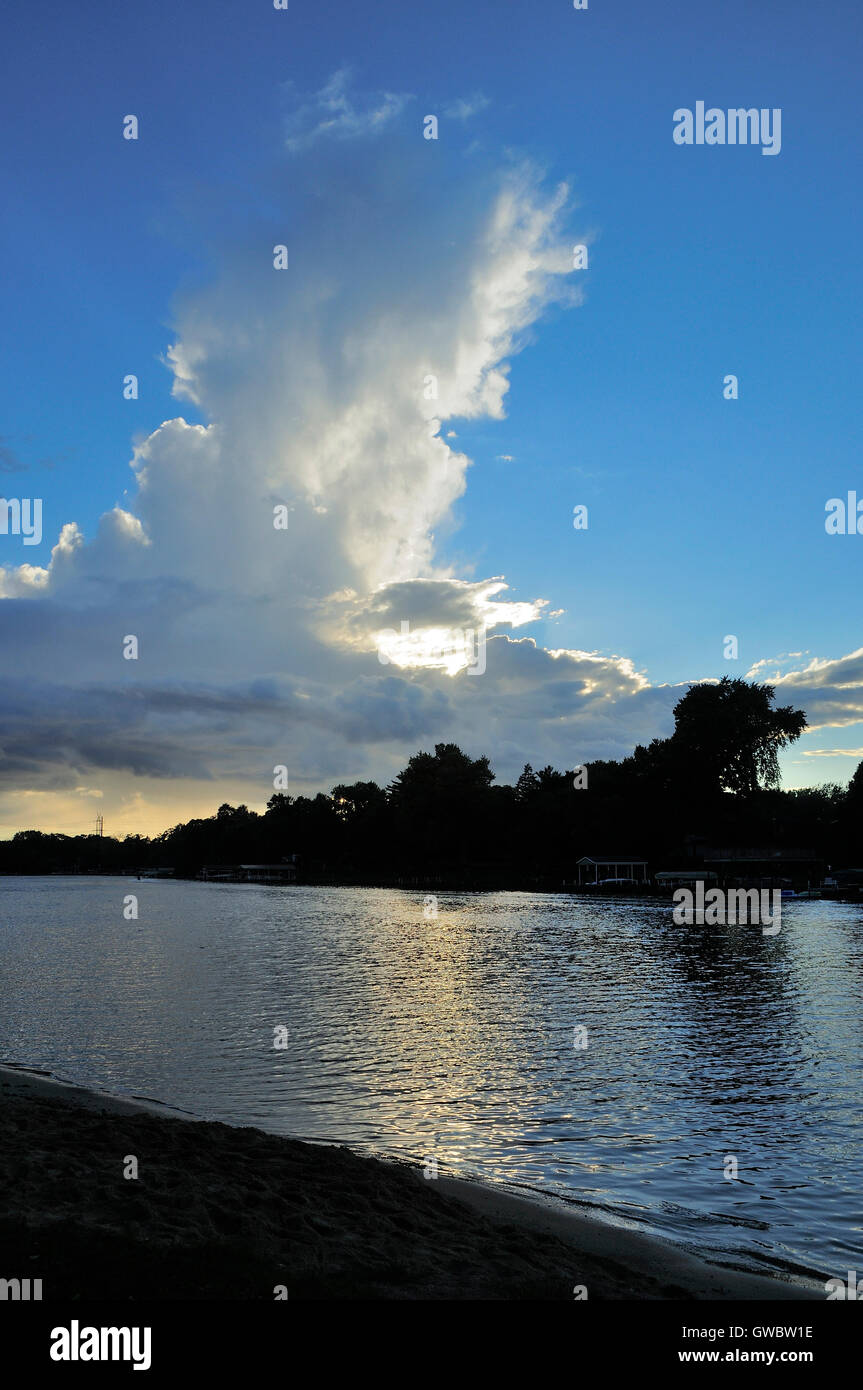 River silhouetted against unusual backlit cloud Stock Photo - Alamy